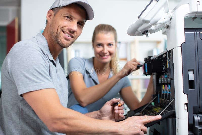 Woman and Man Opening Photocopy Machine in Office Stock Image - Image ...