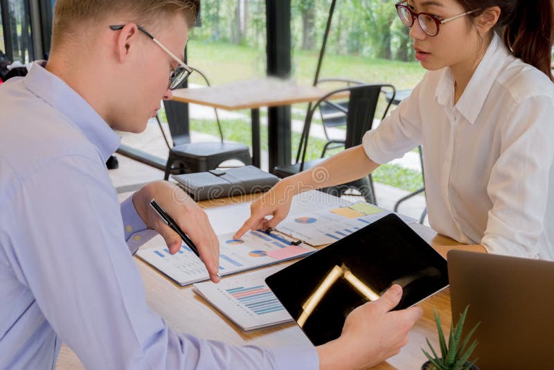 Woman and Man Sitting Facing Table Stock Photo - Image of tables ...
