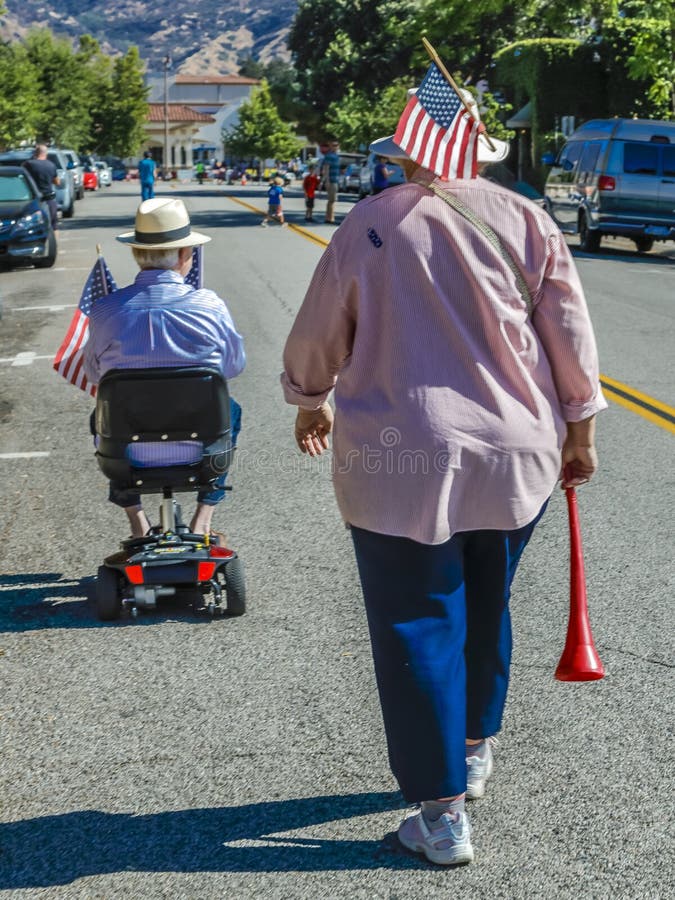 Woman and Man in Wheel Chair are Walking from Parade Editorial Image ...
