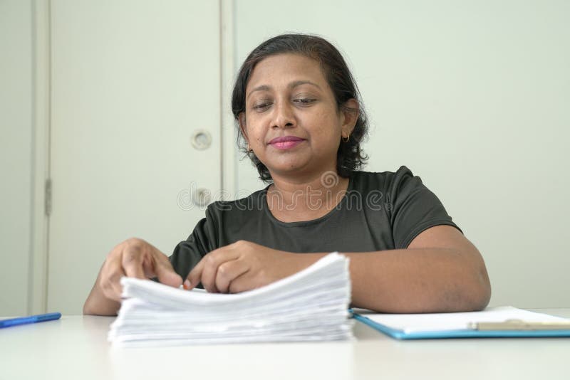 Woman Manager or Executive Going through Documents in File Stock Image ...
