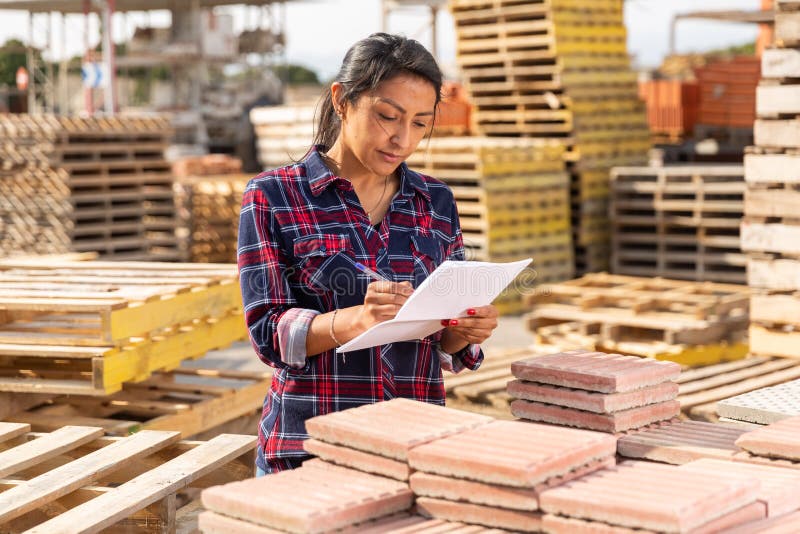 Woman Manager Leads the Accounting of Materials at Construction Site ...