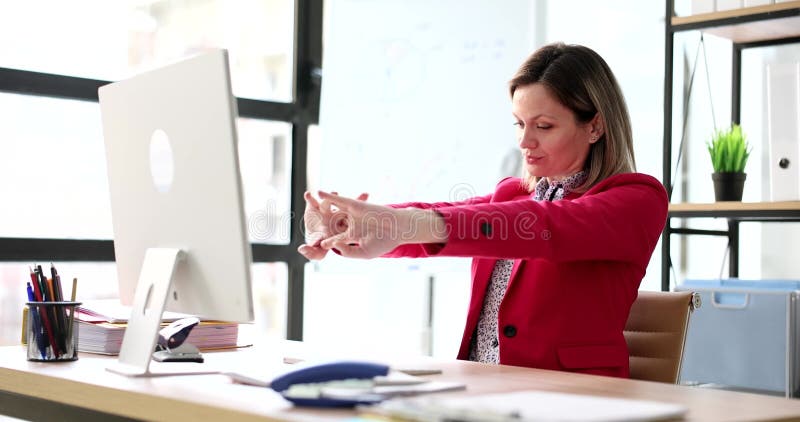 Woman Manager Stretches Hands and Works on Computer Keyboard Stock ... Woman Manager Stretches Hands and Works on Computer Keyboard Stock ...