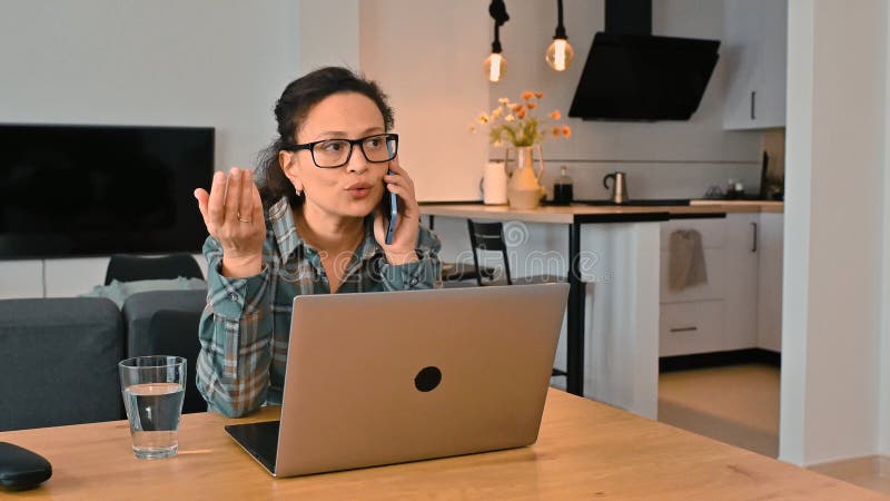 Woman Managing Remote Work from Home Office during a Phone Call Stock Photo - Image of ...