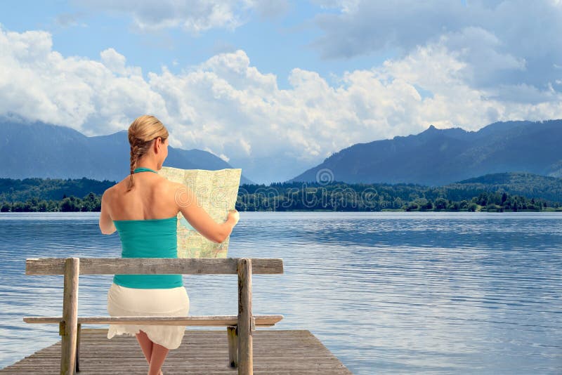 Woman with map on a lake stock image. Image of reading - 26030225