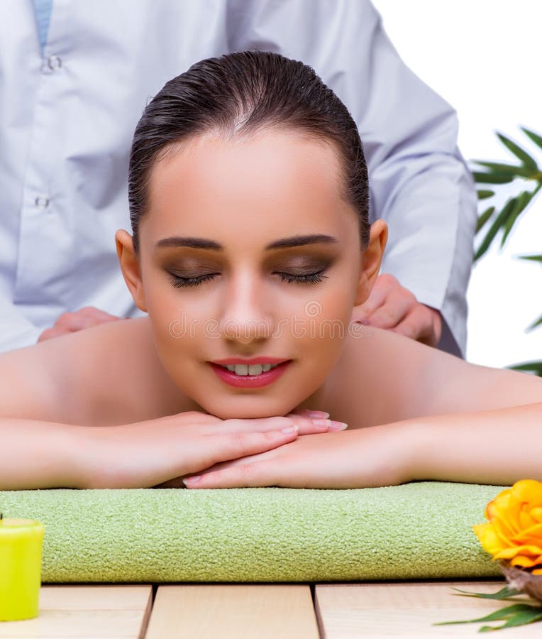 Woman during Massage Session in Spa Salon Stock Photo - Image of pebble ...
