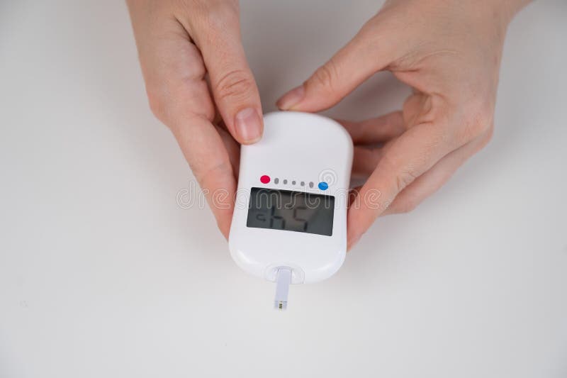 Woman Measures Blood Sugar Level with a Glucometer. Stock Image - Image ...