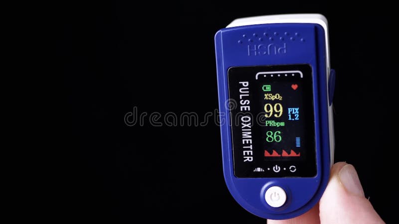 Woman Measures Pulse and Oxygen Saturation Using a Pulse Oximeter at ...