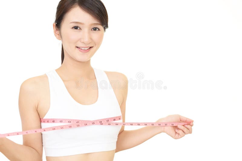 Woman measuring chest stock image. Image of attractive - 132886649