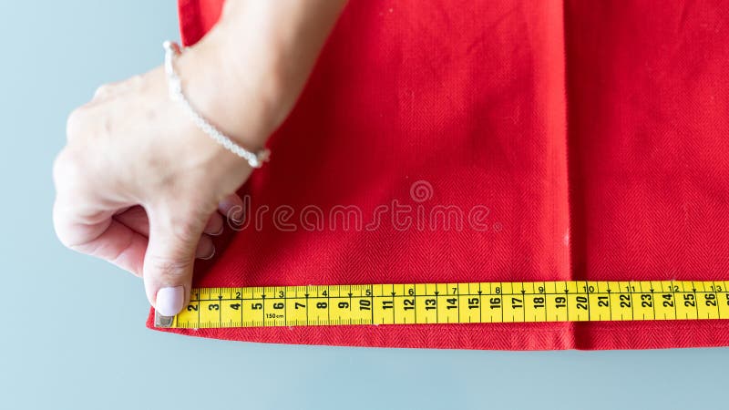 Woman Measuring a Fabric by Hand with the Meter Stock Image - Image of ...