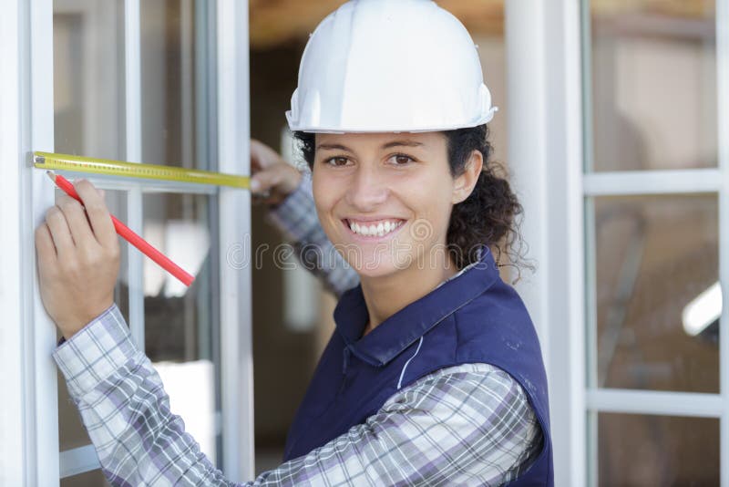 Woman Measuring Window Frame Stock Image - Image of portrait, equipment ...
