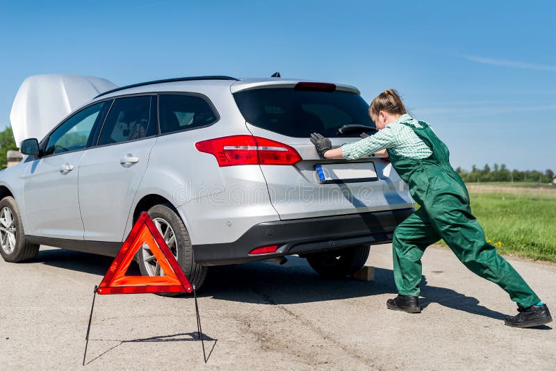 Mechanic with Laptop Diagnosing Broken Car on Roadside Stock Image ...