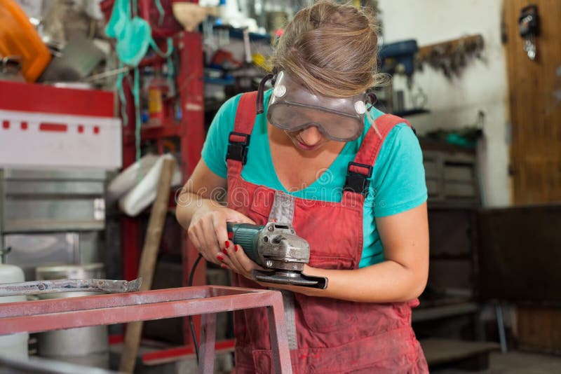 Woman Mechanic Using an Angle Grinder Stock Image - Image of blonde ...