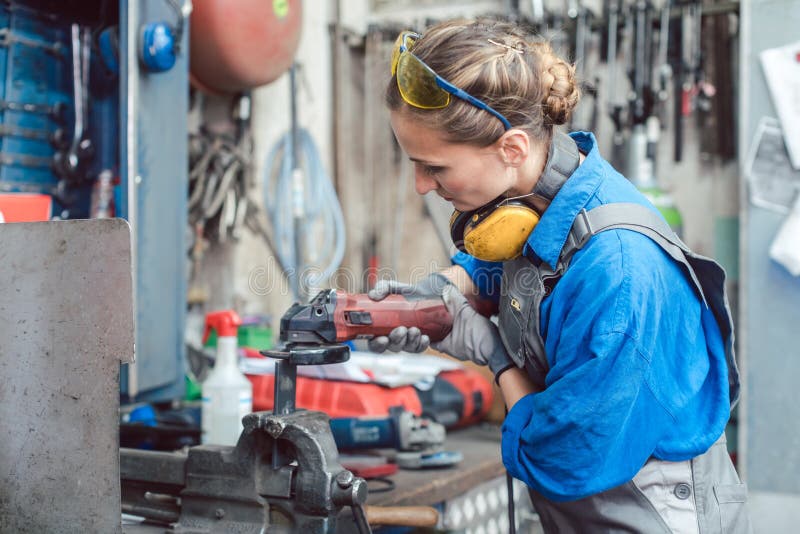 Woman Mechanic Working with Disk Grinder Stock Image - Image of person ...