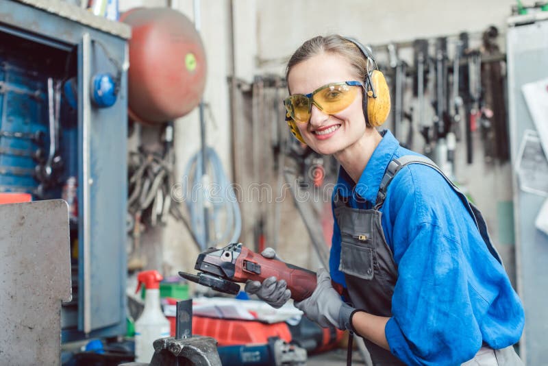 Woman Mechanic Working with Disk Grinder Stock Photo - Image of ...