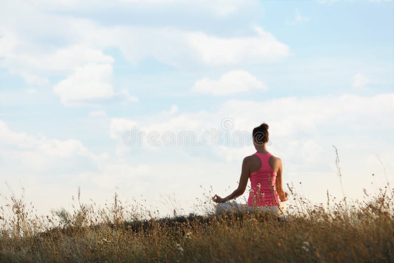 Woman Meditating in Meadow, Back View Stock Image - Image of leisure ...