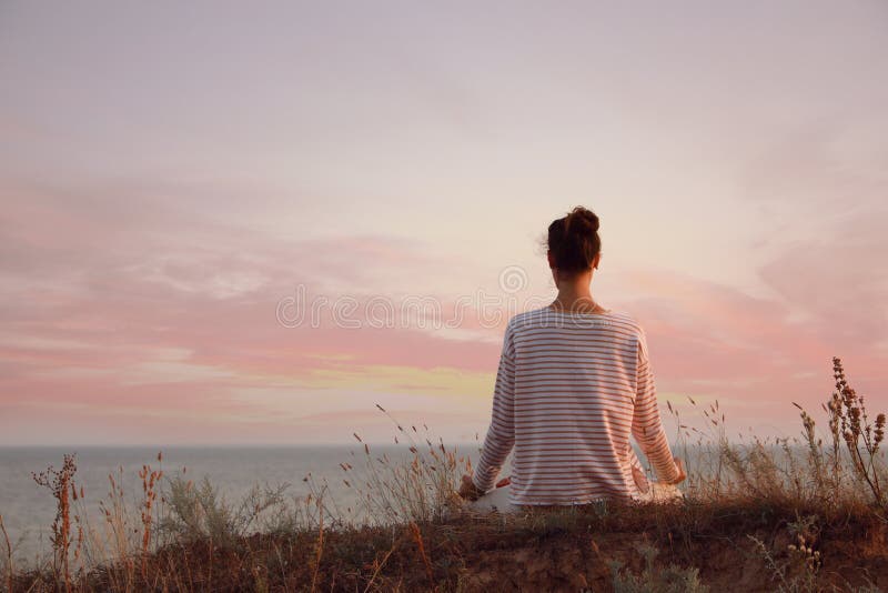 Woman Meditating Near Sea, Back View. Space for Text Stock Image ...