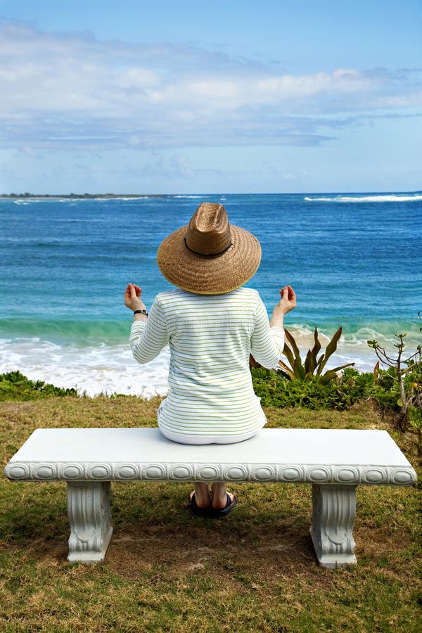 A Woman Meditating by the Sea Stock Image - Image of nature, posture ...
