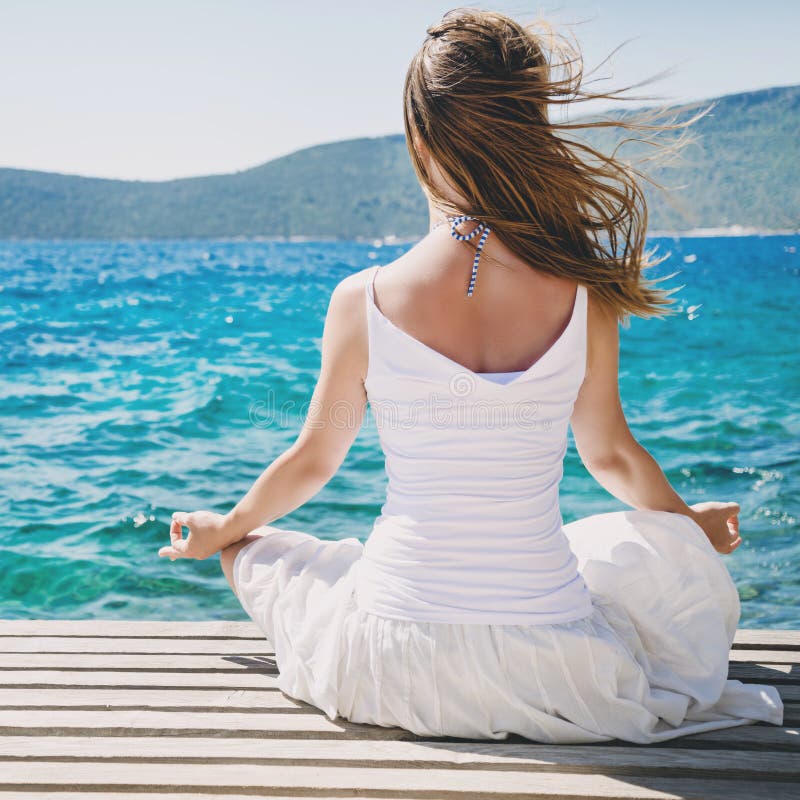 Woman Meditating at the Sea Stock Image - Image of breath, calm: 52231485