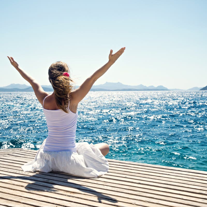 Woman Meditating at the Sea Stock Image - Image of lotus, relax: 52232365