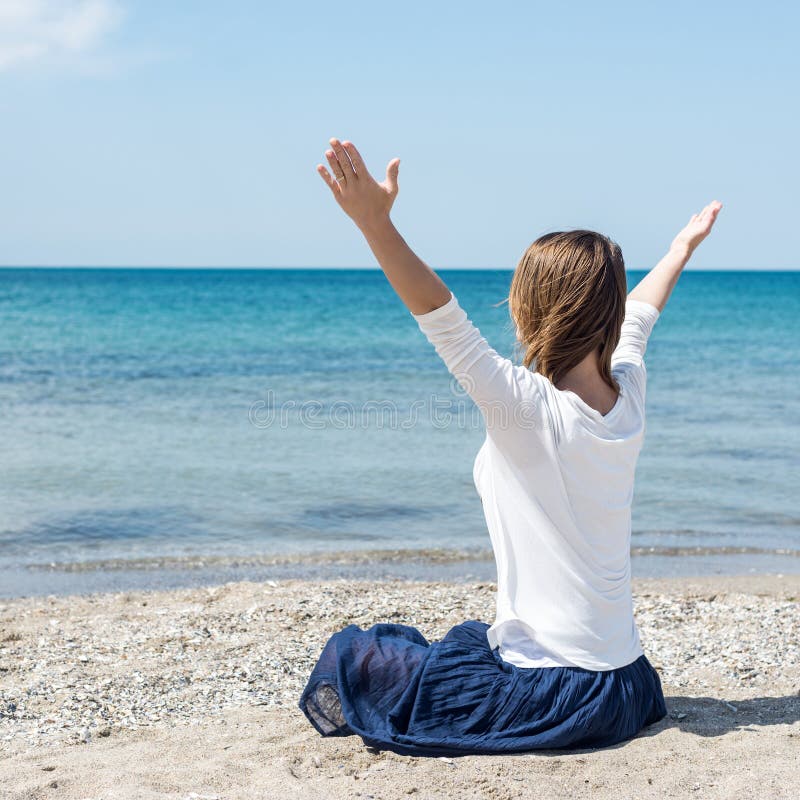 Woman Meditating at the Sea Stock Photo - Image of beach, equanimity ...