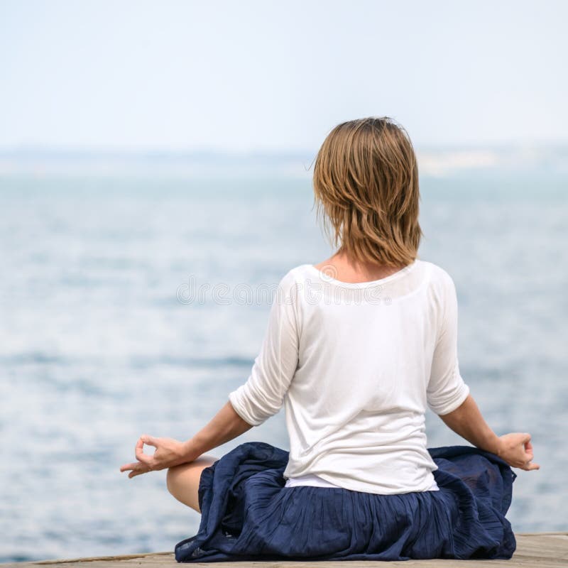 Woman Meditating at the Sea Stock Photo - Image of serenity, person ...