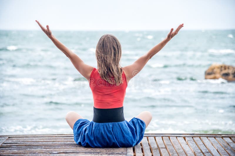 Woman Meditating at the Sea Stock Photo - Image of active, lifestyle ...