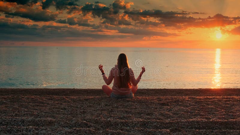 Woman Meditating on the Seashore Stock Image - Image of relax, back ...