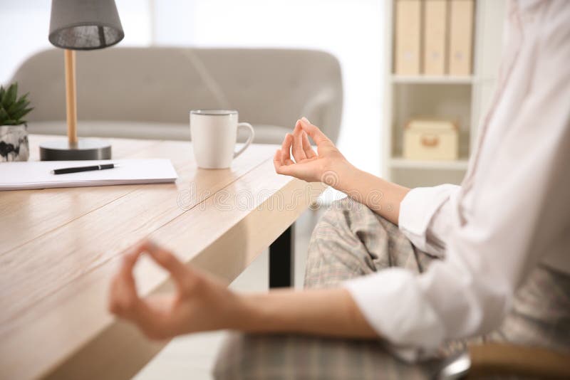 Woman Meditating at Workplace in Office, Closeup Stock Image - Image of ...