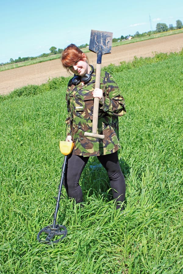 Woman with metal detector stock image. Image of finding - 54549229