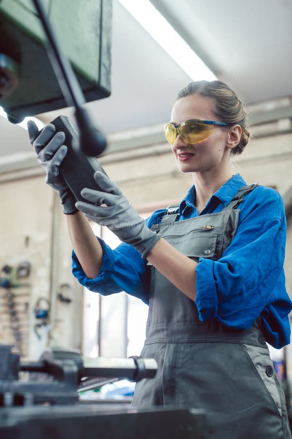 Woman in Metal Workshop Checking Workpiece Stock Image - Image of ...