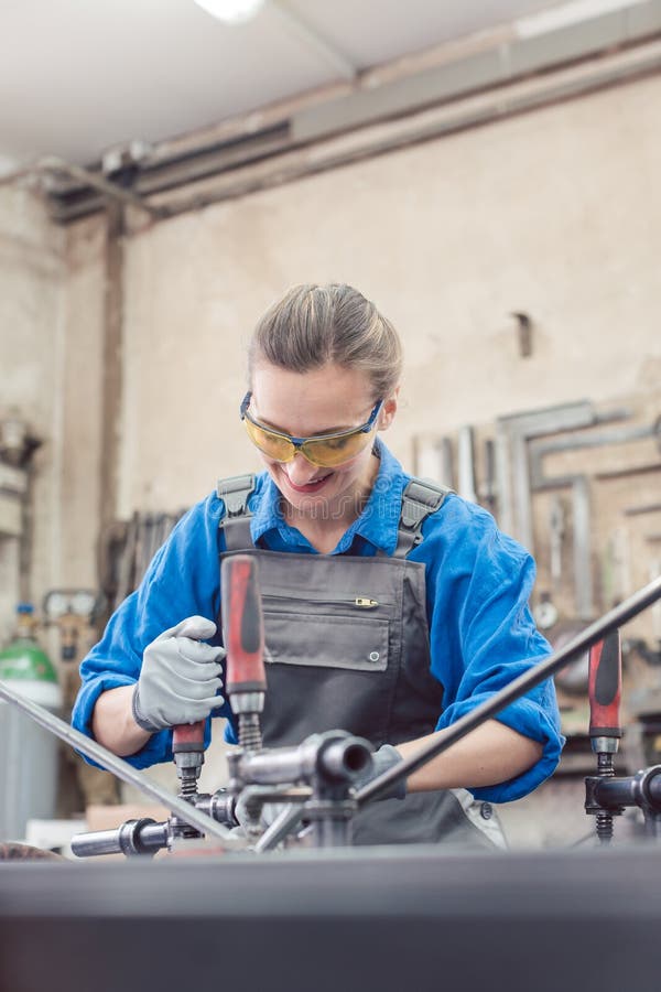 Woman in Metal Workshop with Tools and Workpiece Stock Photo - Image of ...