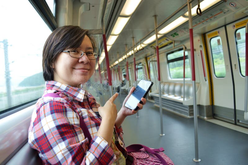 Woman at the metro train stock image. Image of female - 30860577