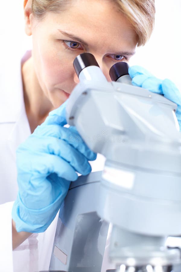 Woman with microscope stock photo. Image of medical, people - 17029720