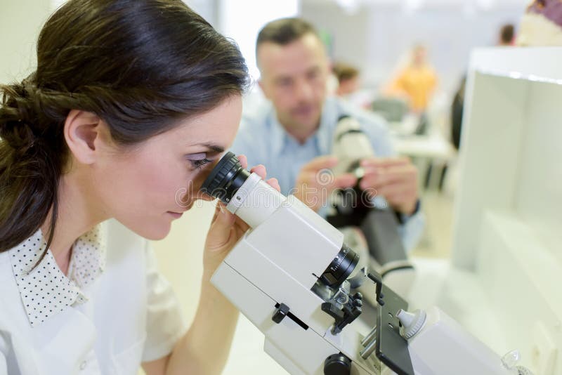 Woman with Microscope in Microelectronics Laboratory Stock Image ...