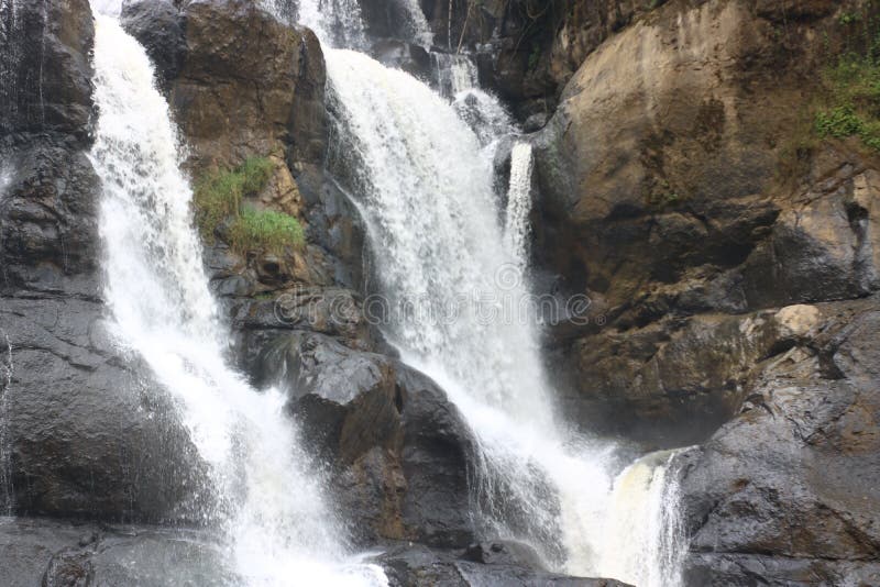 The Water Falls with a Large Rock Stock Image - Image of environment ...
