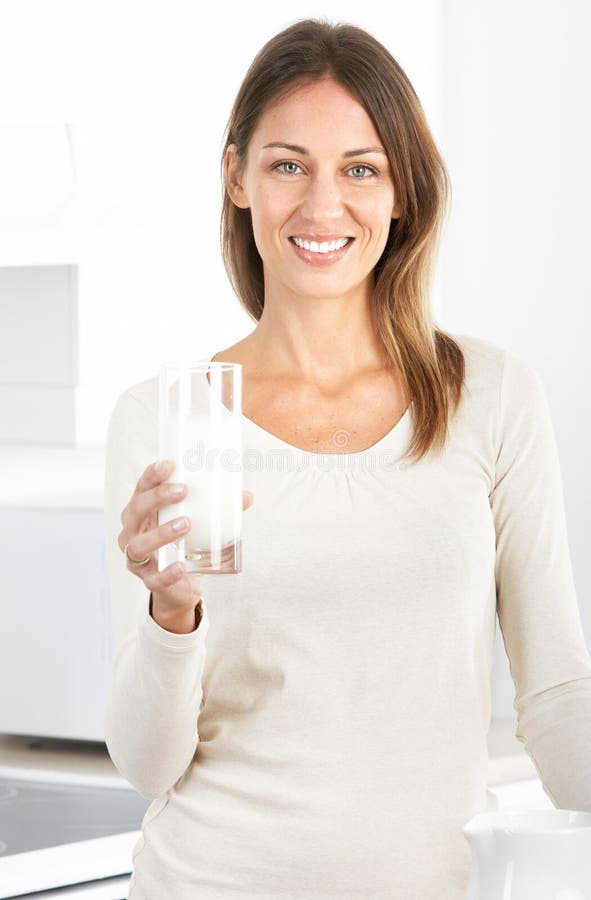 Woman with milk stock photo. Image of home, milk, breakfast - 13764704