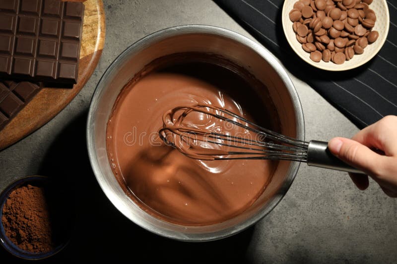 Woman Mixing Chocolate Dough with Whisk at Grey Table, Top View Stock ...