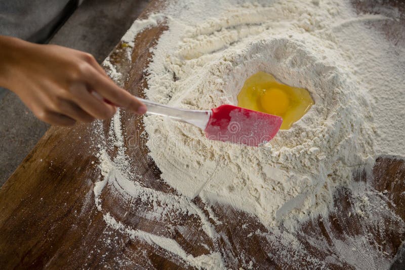 Woman Mixing Flour and Egg with a Batter Spatula Stock Photo - Image of ...