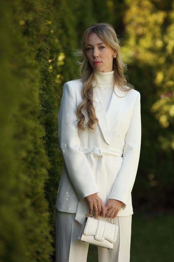 Woman Model in White Suit Posing Stock Photo - Image of dress, clothes ...
