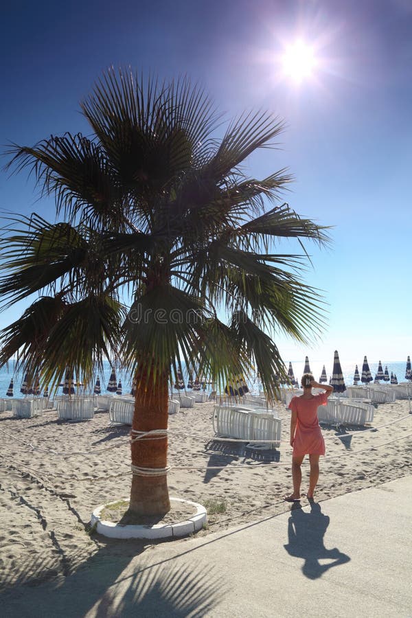 Boy Stands on Beach and Pours Sand Watering-can Stock Photo - Image of ...