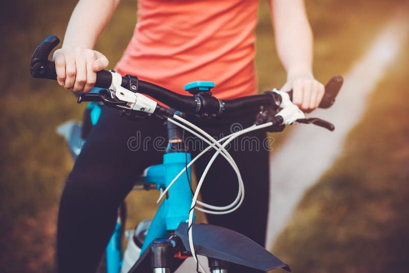 Woman Mountain Biking and Holding Handlebars Stock Image - Image of ...