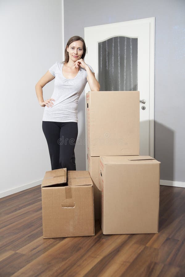 Woman moving house stock photo. Image of holding, adult - 26598922