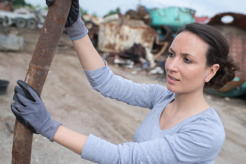Woman Moving Metal Bar in Scrap Yard Stock Image - Image of discarded ...
