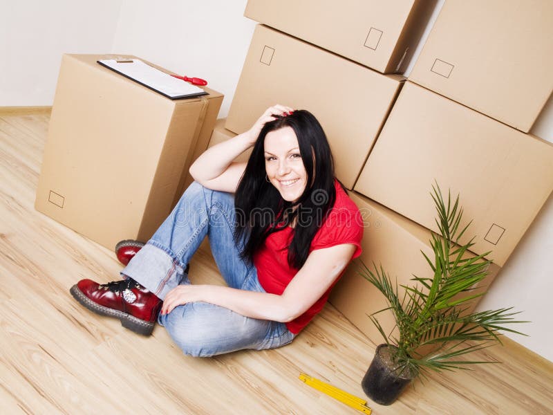 Woman moving to new house stock image. Image of beautiful - 14245805