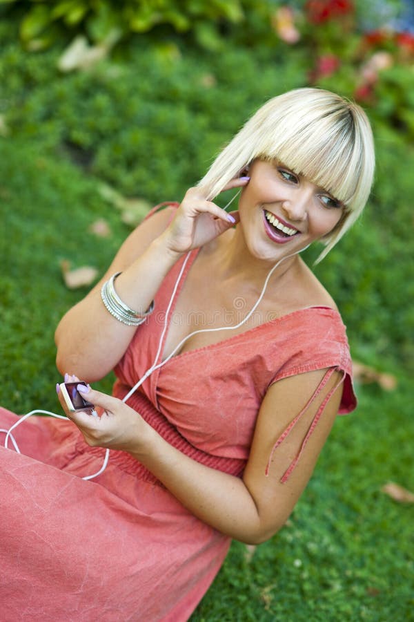 Woman with mp3 player stock photo. Image of listen, woman - 26557418