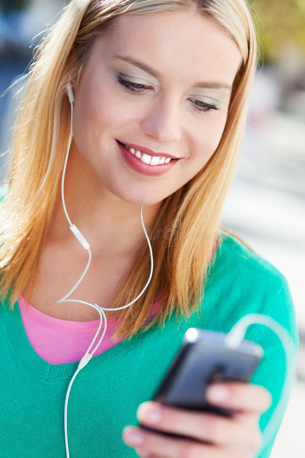 Woman with mp3 player stock photo. Image of woman, adult - 27664754