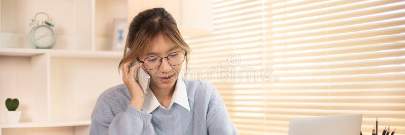 Woman Multitasking: Take Note, Talking on Phone at Home Office Stock ...