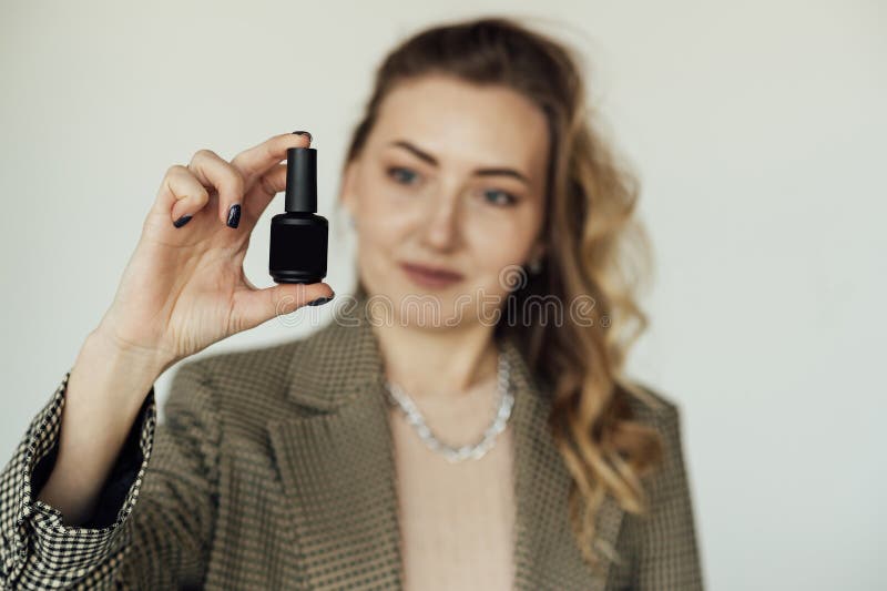 Woman Nails Master Demonstrates New Modern Nail Polish Stock Image