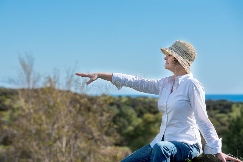 Woman in Nature Pointing Away Stock Image - Image of summer, blue: 46664335