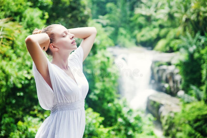 Woman Sitting Near Waterfall Stock Image - Image of bali, relax: 61742969